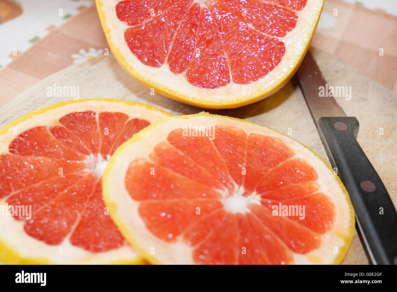 grapefruit bright red and cut by segments Stock Photo - Alamy