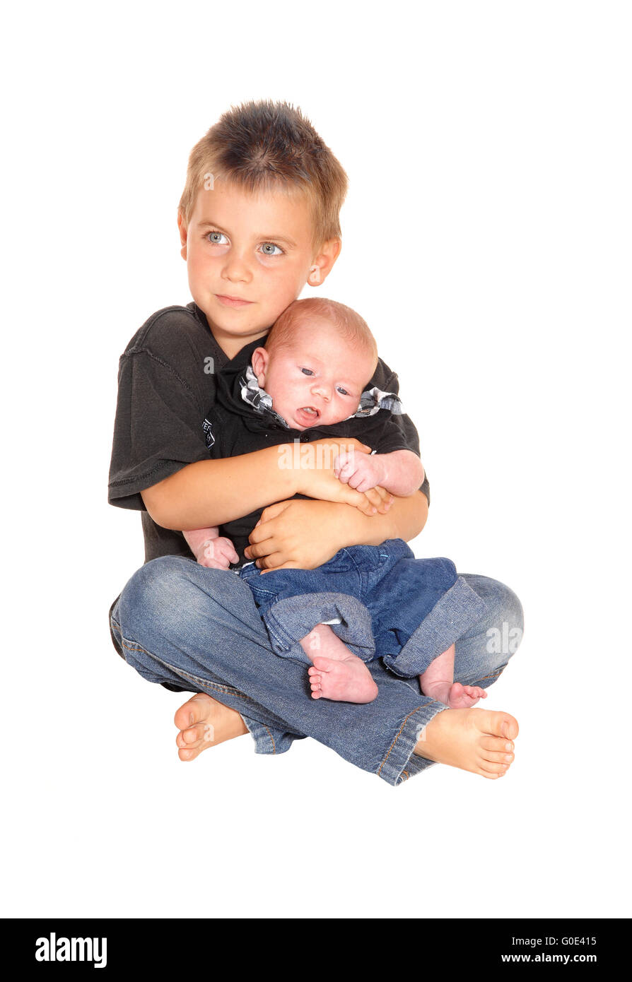 Boy holding infant boy hi-res stock photography and images - Alamy