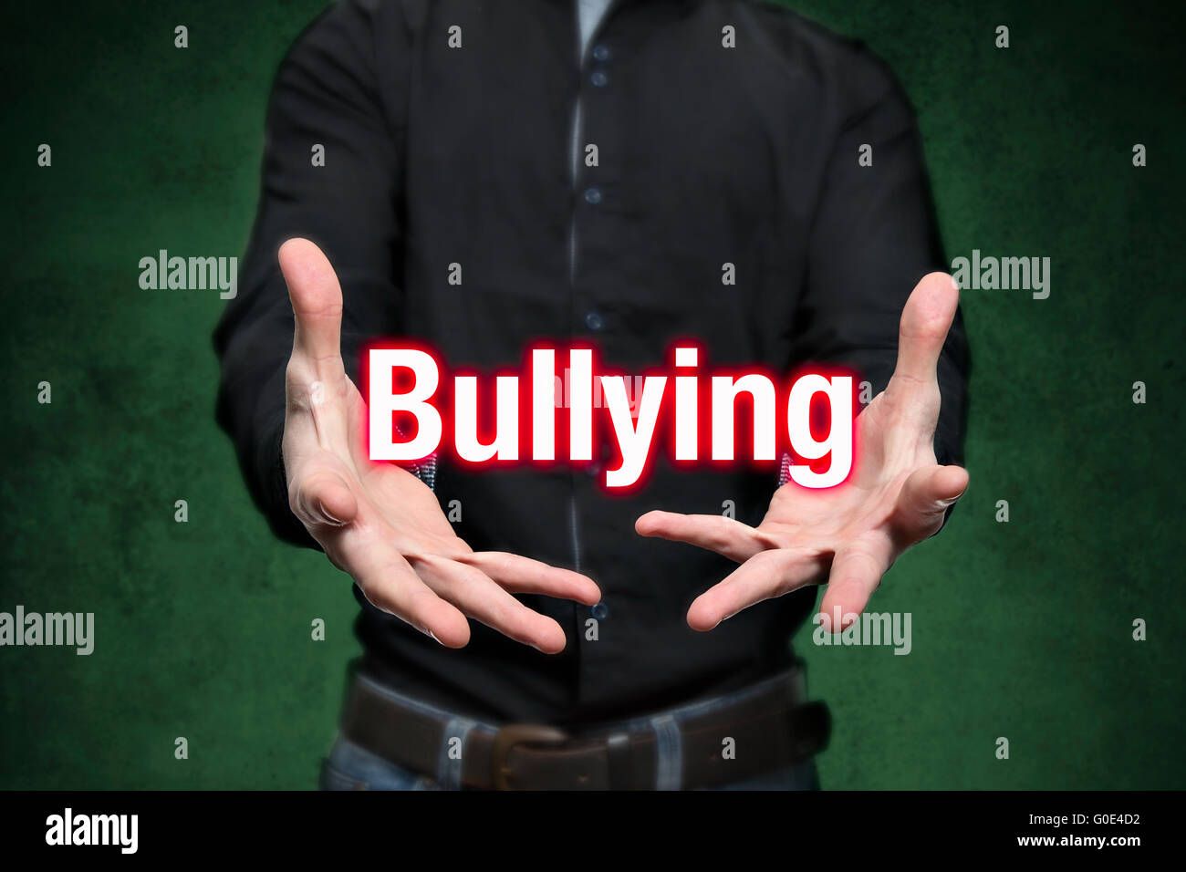 Mobbing, bullying, man holds lettering in the hands Stock Photo - Alamy