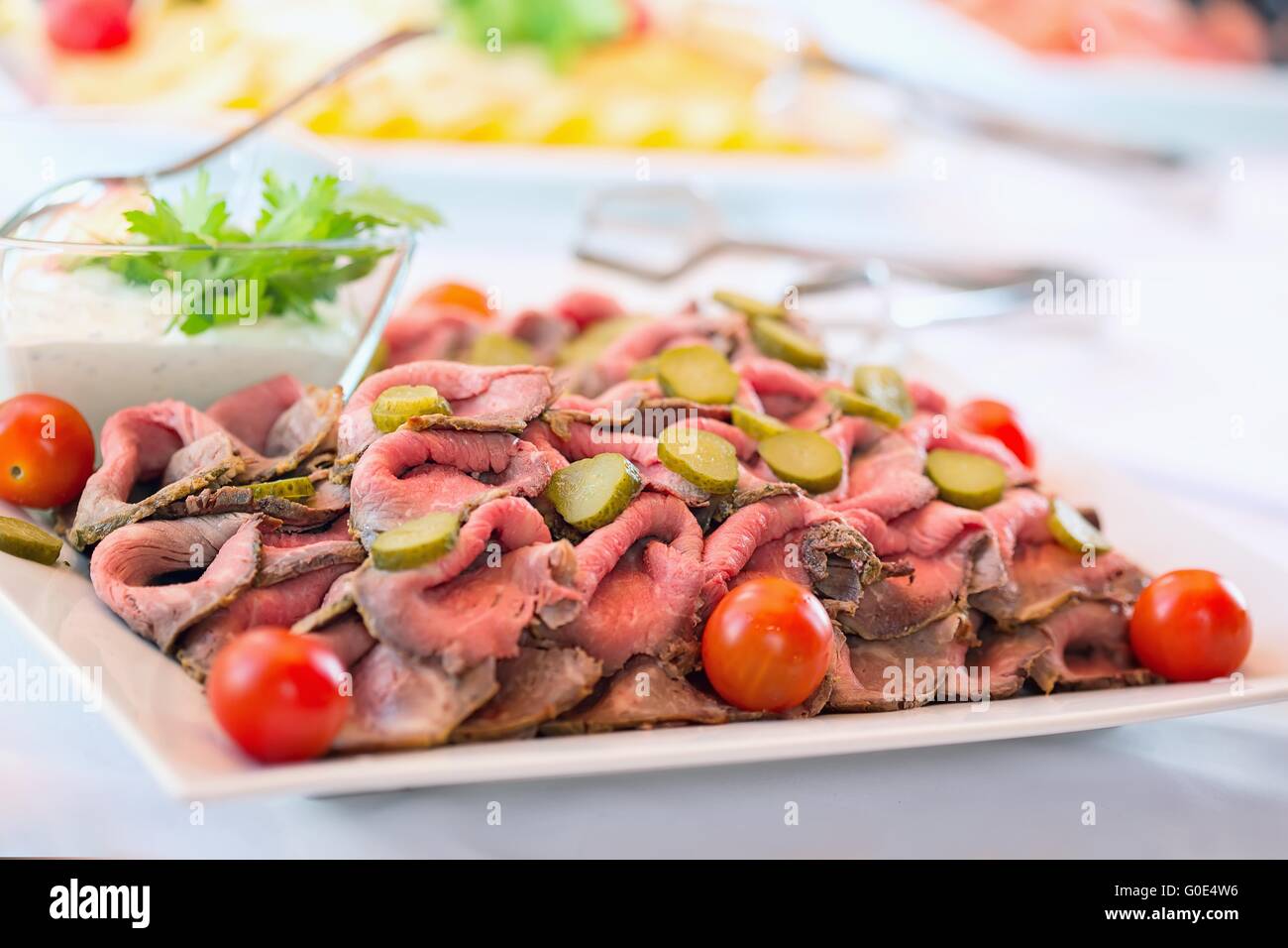 Slices of freshly prepared roast beef on a plate Stock Photo - Alamy