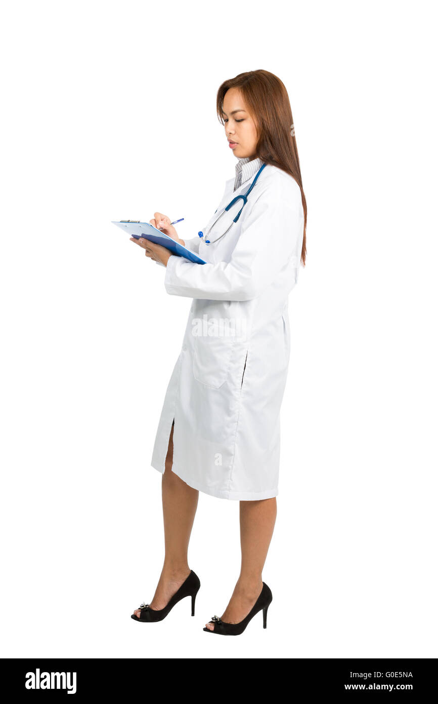 Female Asian Doctor Writing Looking At Notes Full Stock Photo - Alamy