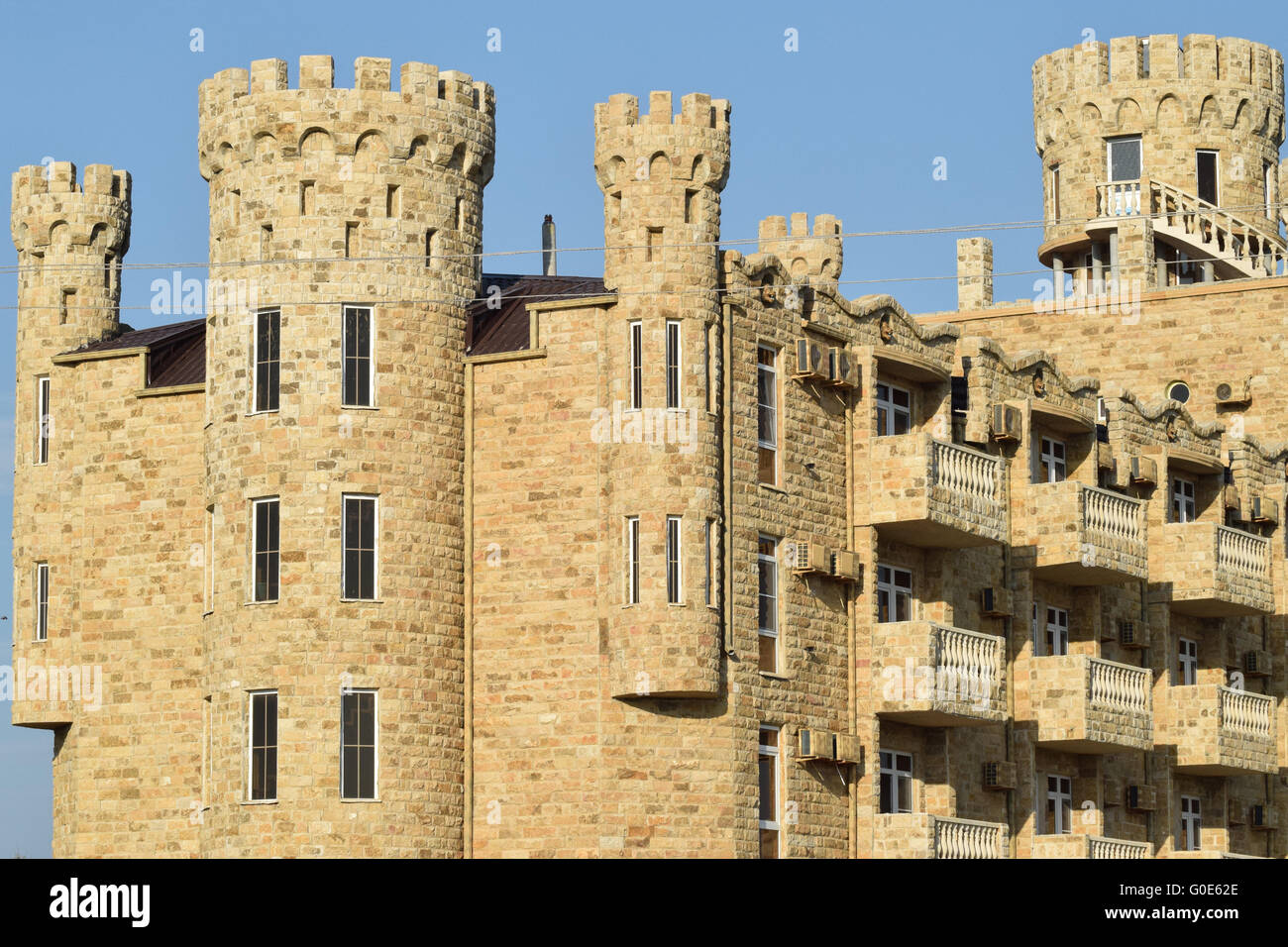 The hotel in form of lock revetted with the Dagestan stone Stock Photo ...