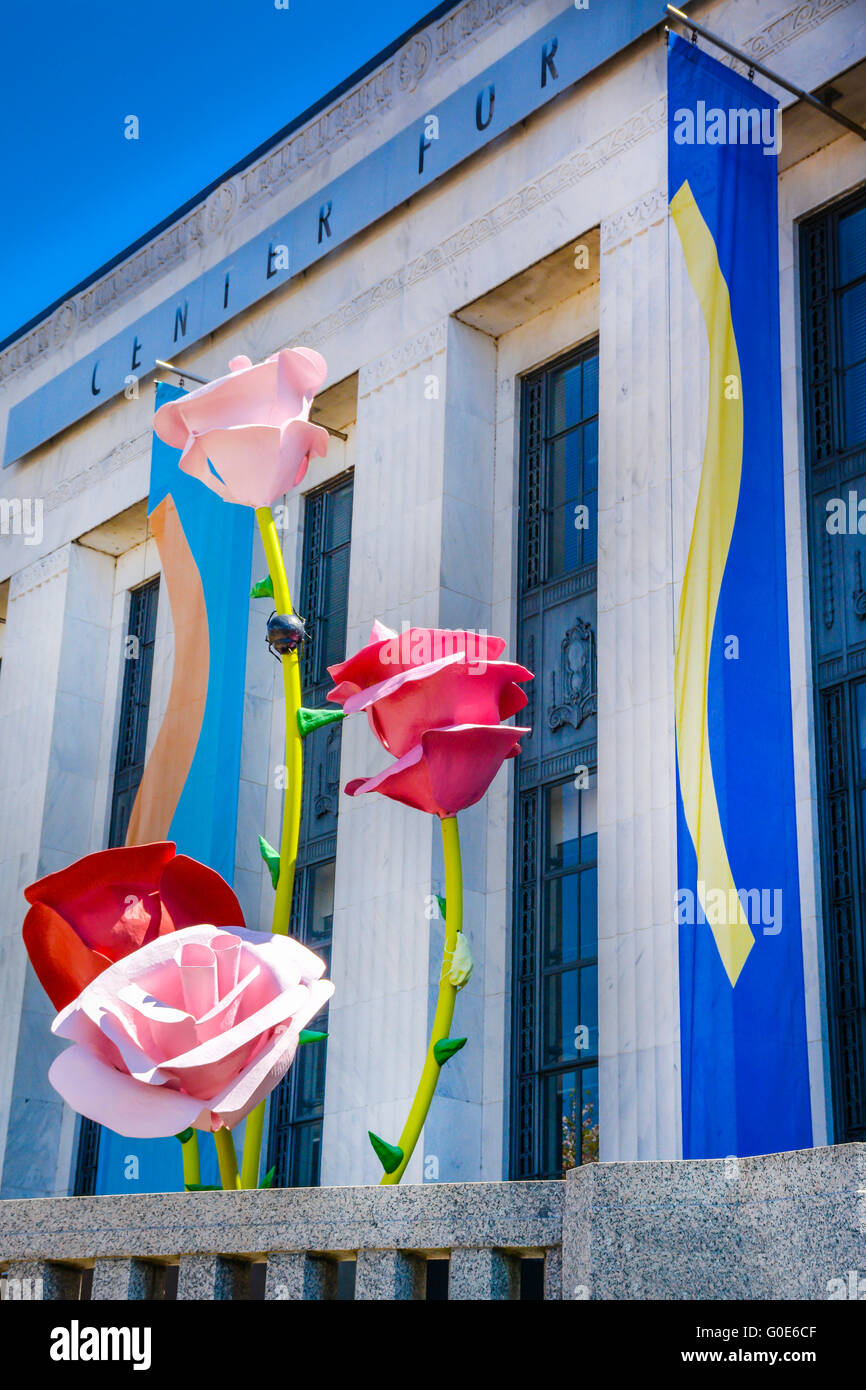 Red & Pink Long stem Roses sculpted in metal rise up in front of the ...
