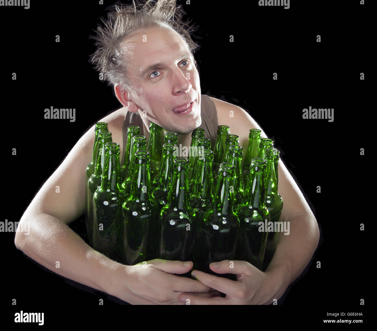 tipsy man near empty beer bottles Stock Photo - Alamy
