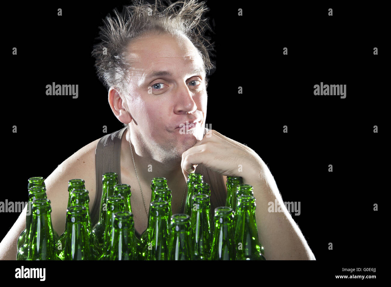 happy tipsy man near empty beer bottles Stock Photo - Alamy