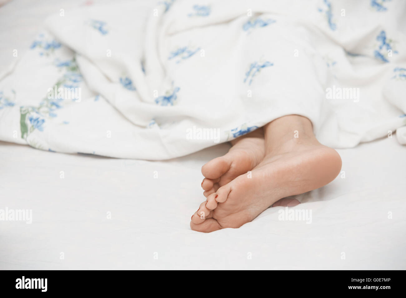 Feet of sleeping woman Stock Photo - Alamy