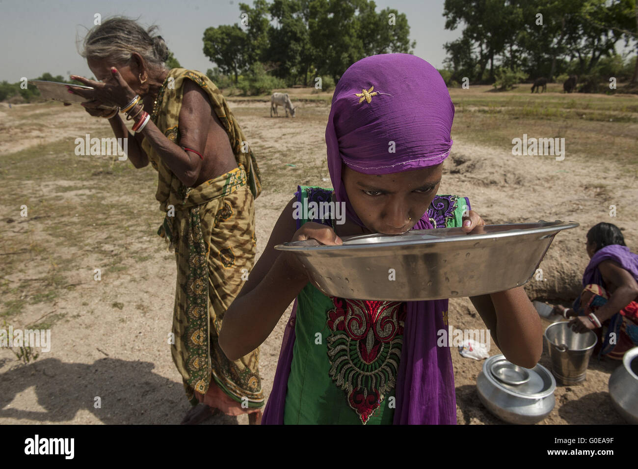 Beijing, India. 24th Apr, 2016. Indian women drink water after ...