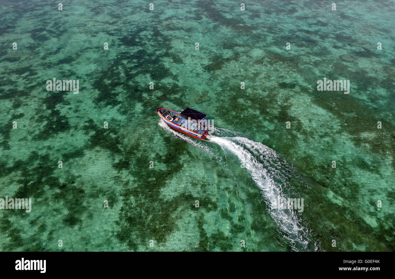 Sansha, China's Hainan Province. 30th Apr, 2016. A boat moves on the ...