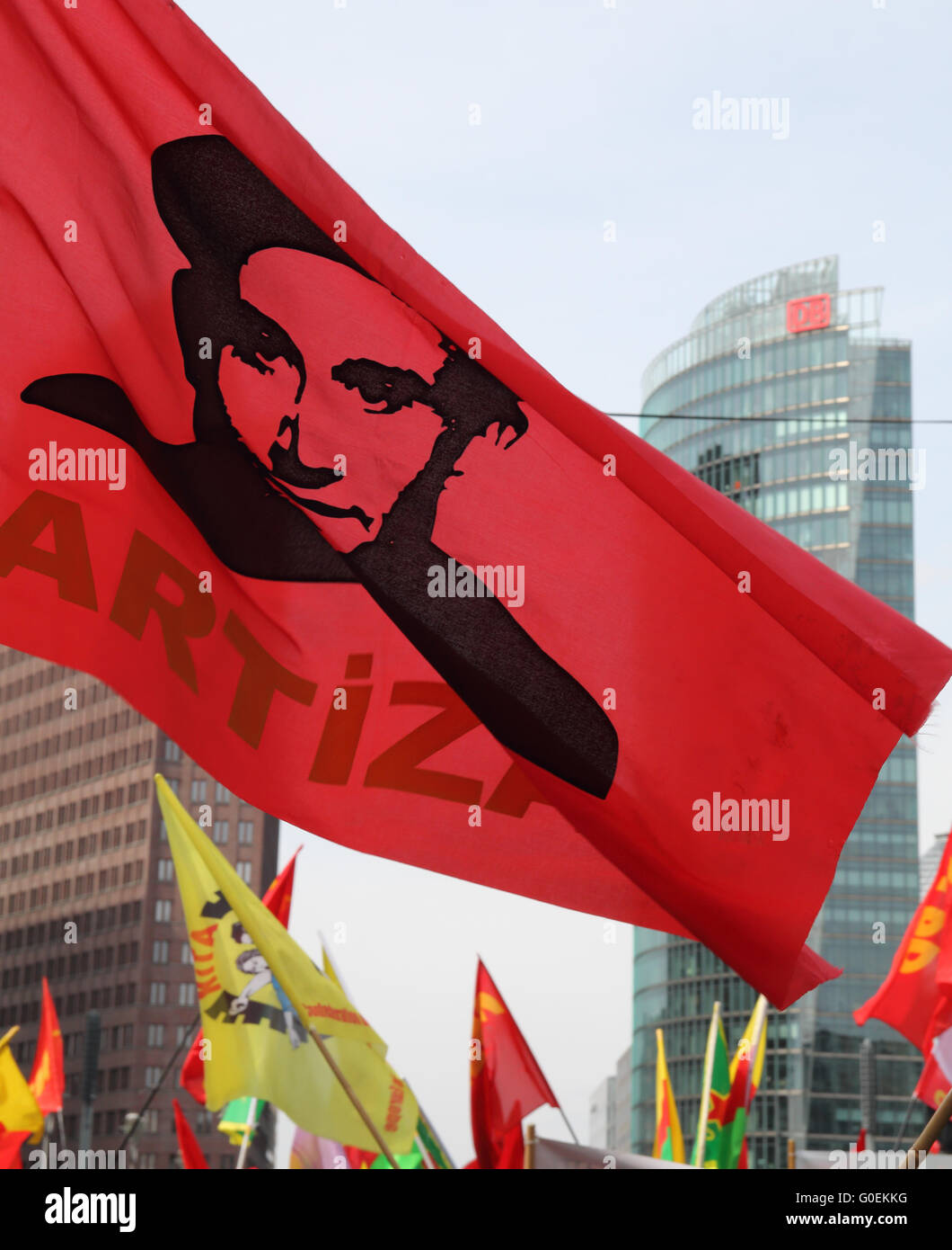 Red partisan flag and other flags with Potsdamer Platz buildings in the ...