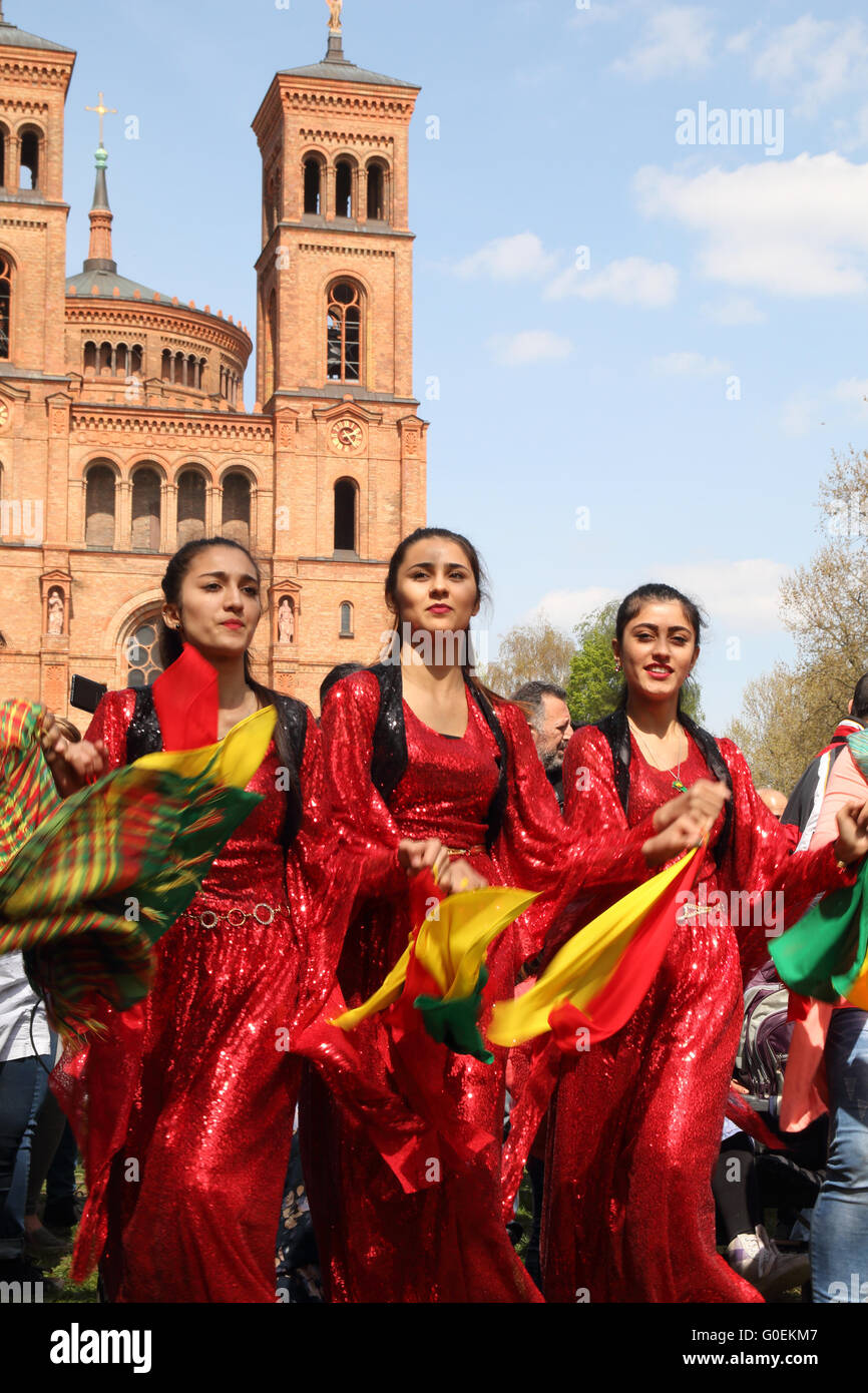 Three ladies in Middle Eastern costumes dancing with a church in the ...