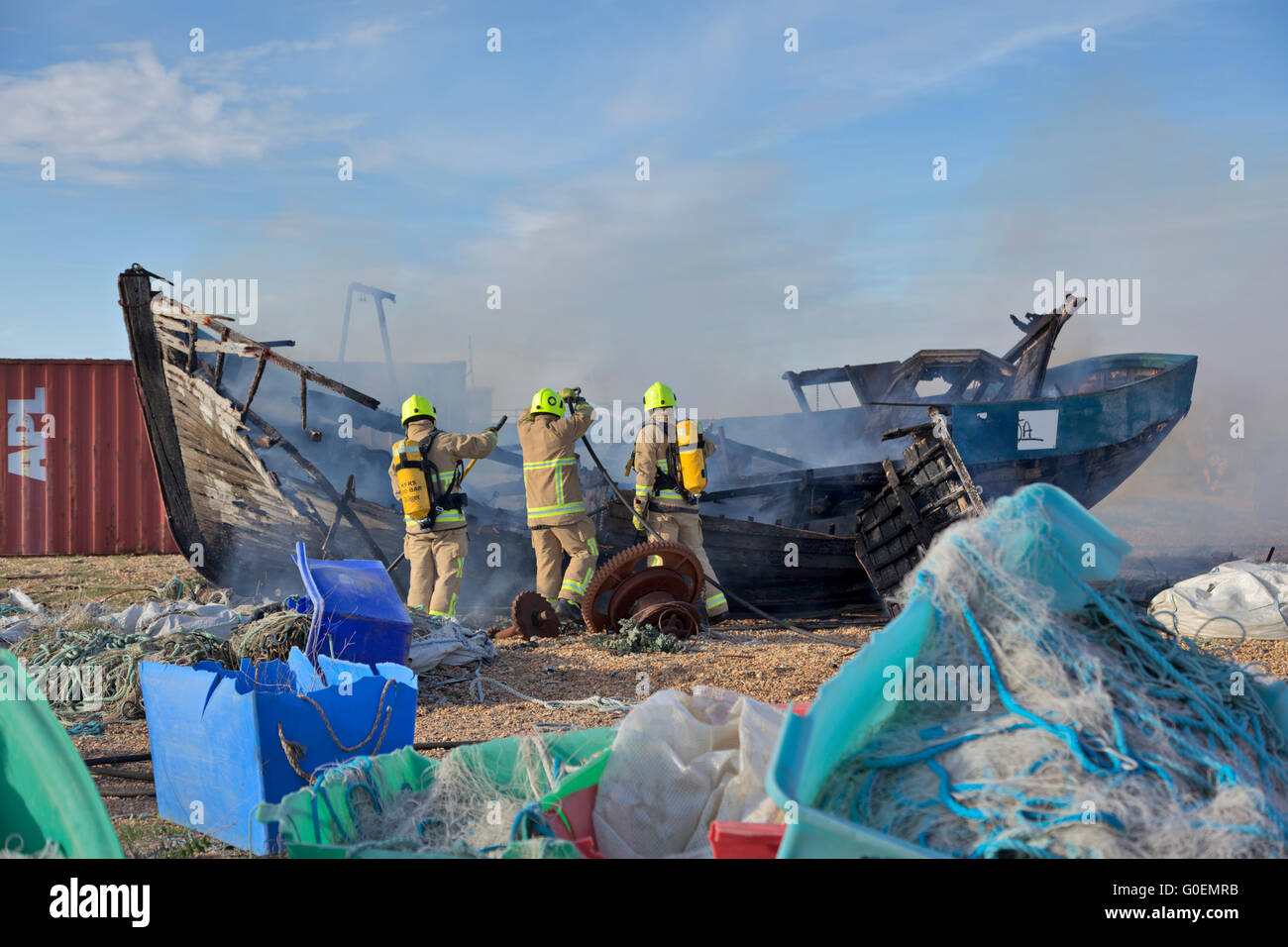 Dungeness beach, Kent, UK. Vandals set alight one of the derelict ...
