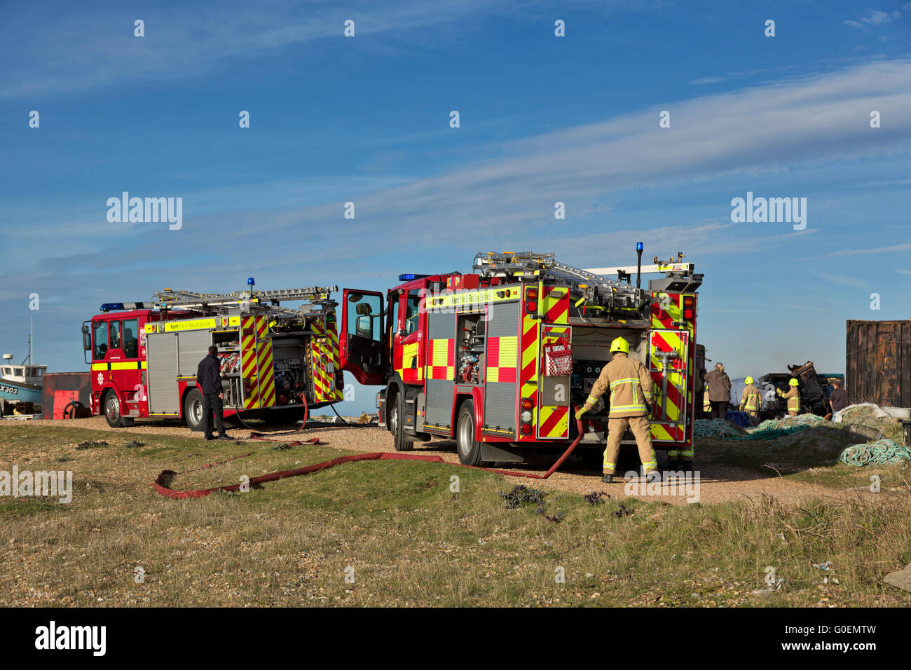 Dungeness beach, Kent, UK. Vandals set alight one of the derelict ...