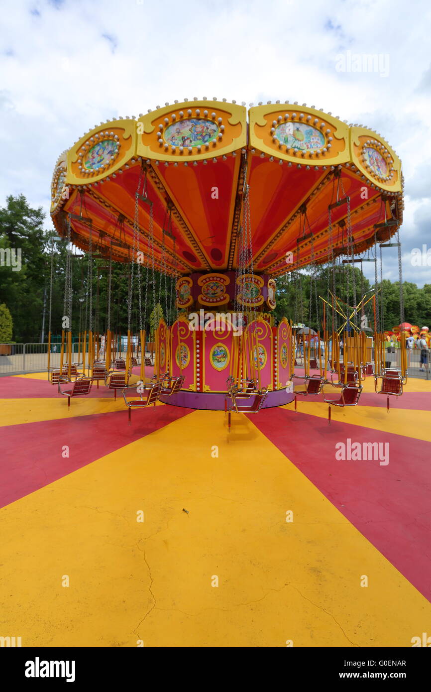 Carousel at amusement park Stock Photo - Alamy