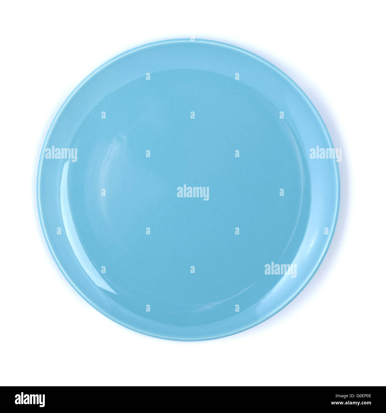 Empty plate of blue color on a white background Stock Photo - Alamy