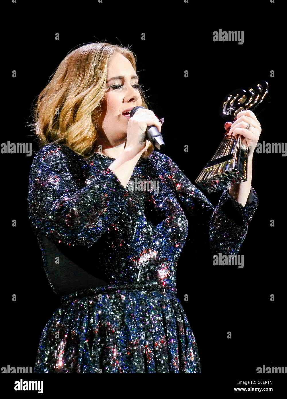 Adele wins an award whilst on stage in Birmingham as she wraps her UK ...