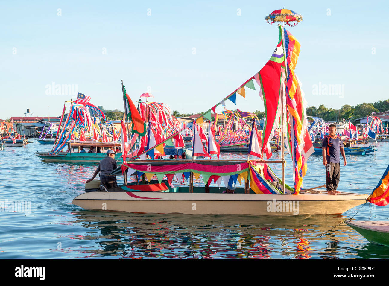 A family of Bajau ethnic inside the Traditional Bajau's boat called ...