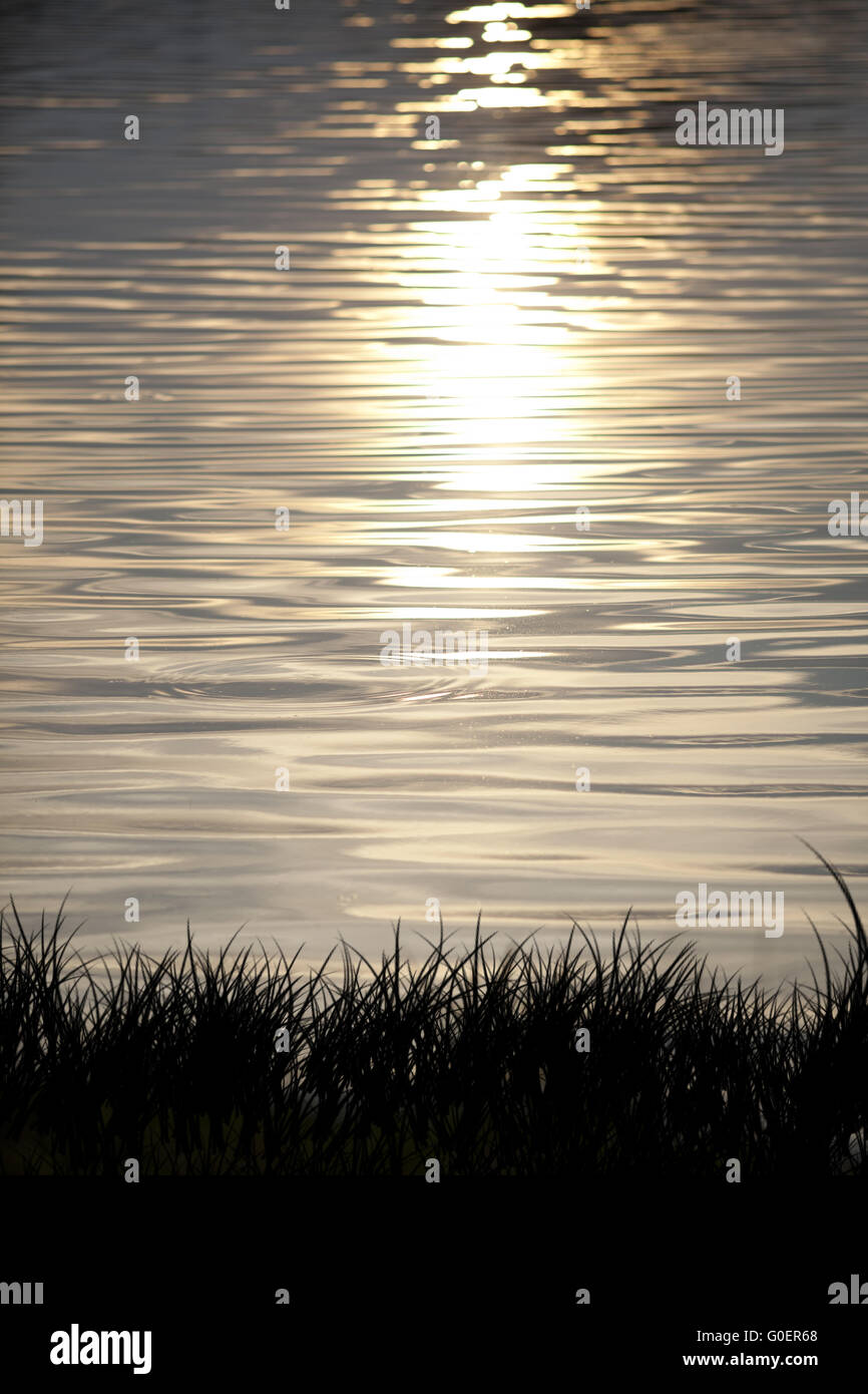 Sparkling water with lights of sunset Stock Photo - Alamy