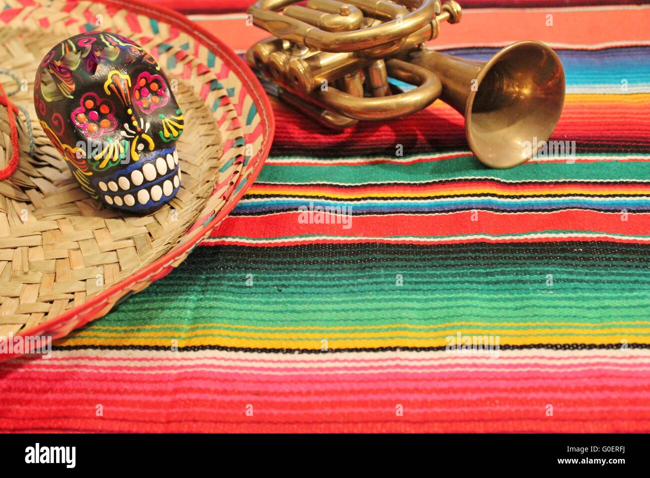 Mexico sombrero rug poncho skull trumpet Stock Photo - Alamy