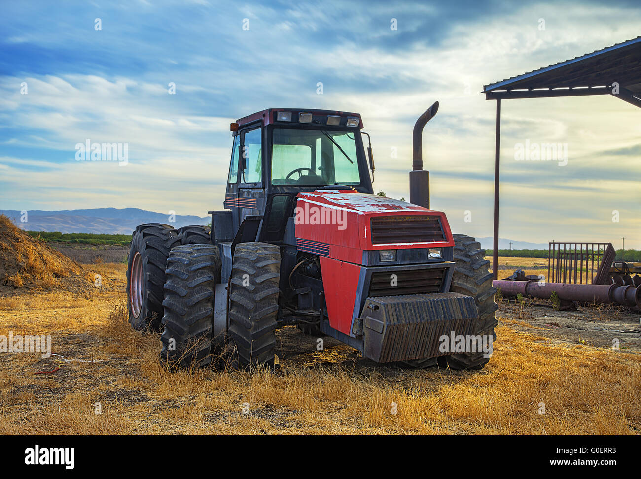 Tractor on the Field Stock Photo - Alamy