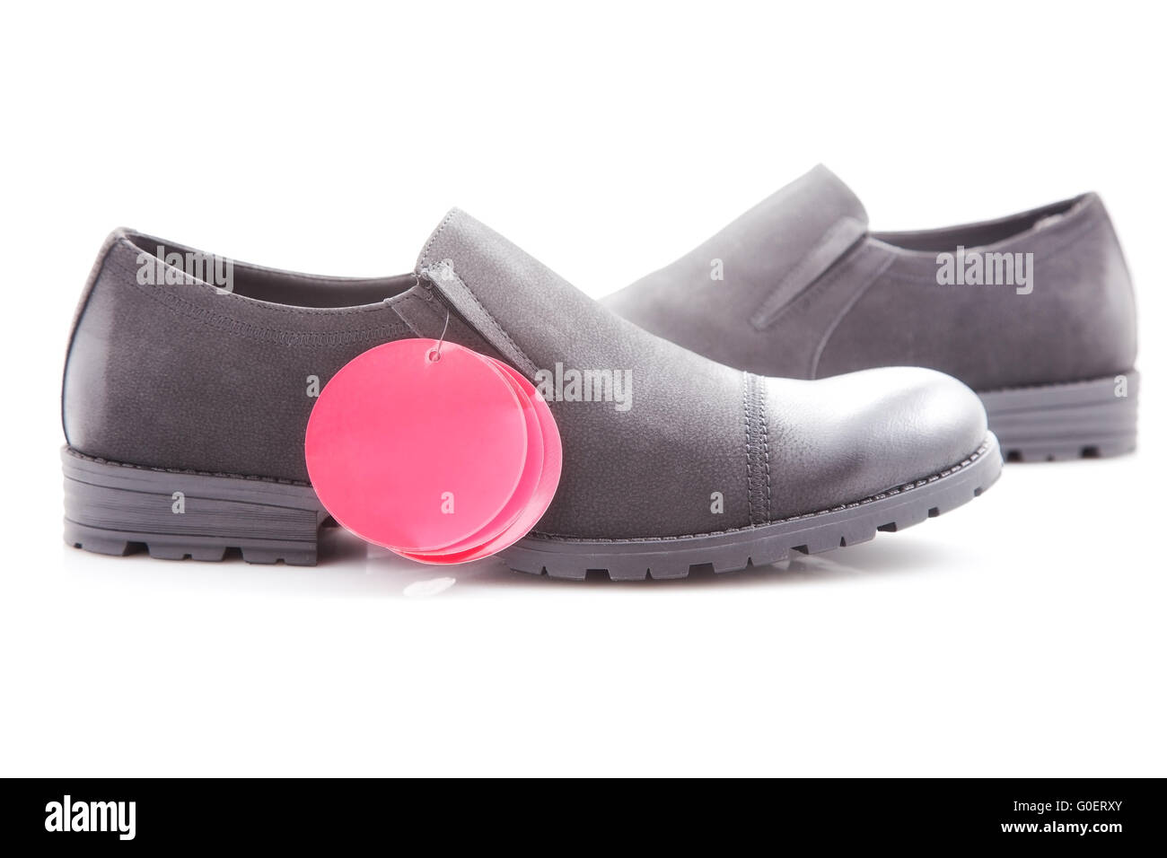 men's dress shoes with red price tag on a white background Stock Photo ...