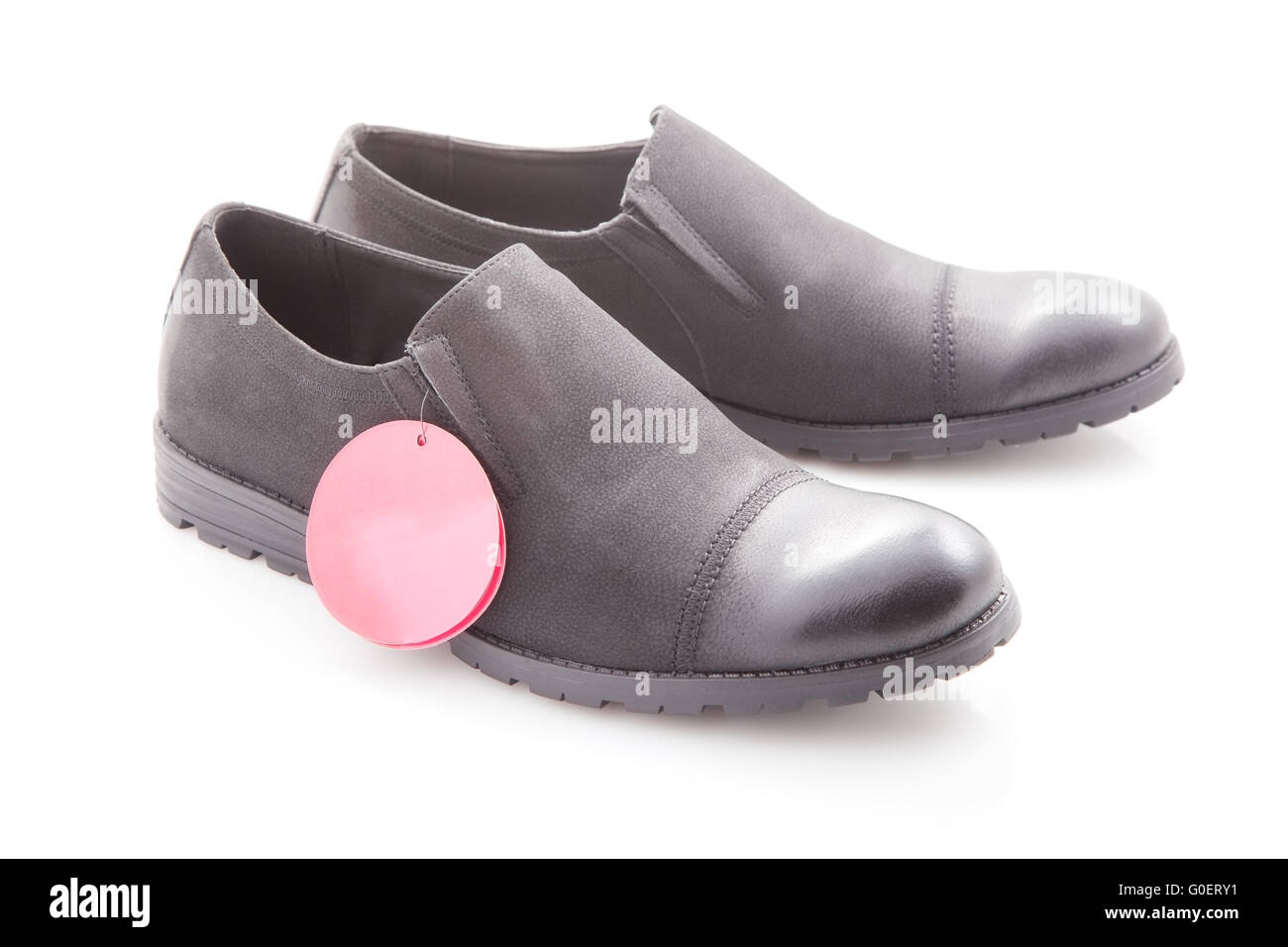 men's dress shoes with red price tag on a white background Stock Photo ...