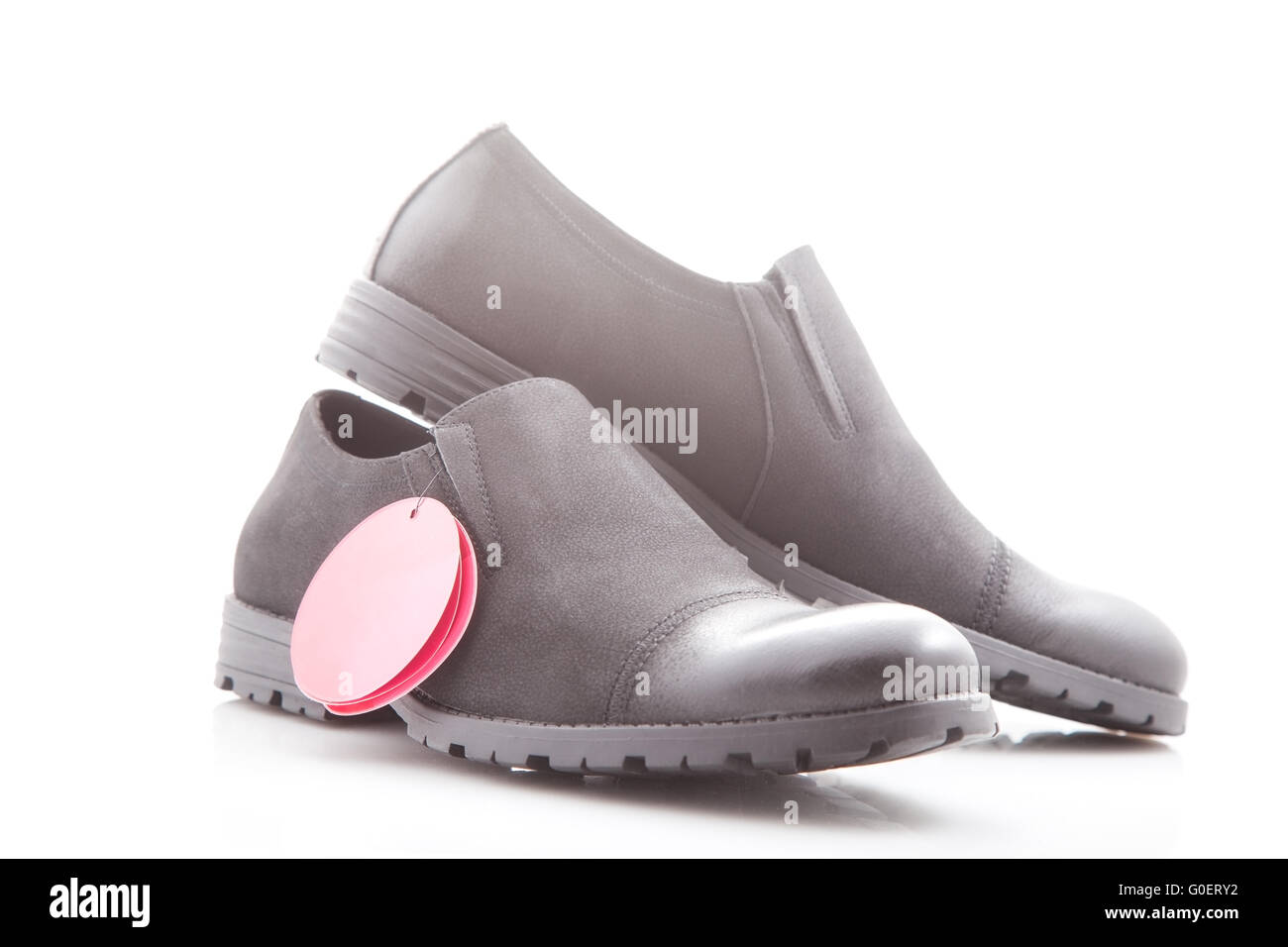 men's dress shoes with red price tag on a white background Stock Photo ...