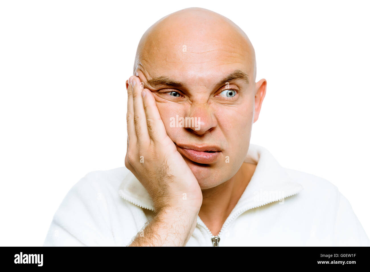 man holding his hand to his cheek. Toothache or problem Stock Photo - Alamy