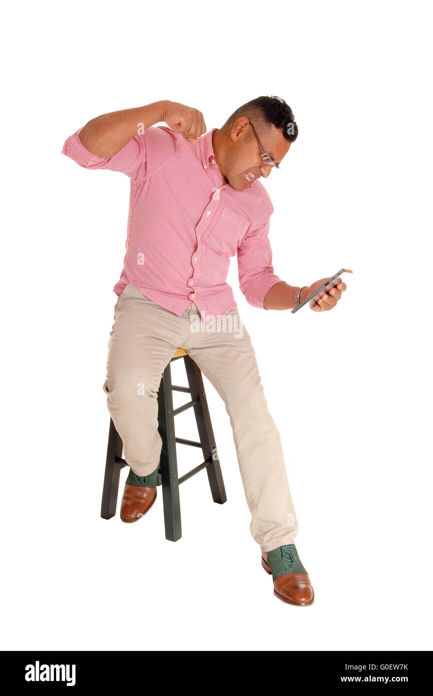 Man screaming at his tablet computer Stock Photo - Alamy