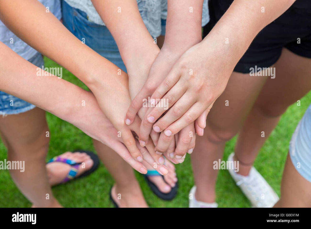 Hands holding other symbol friendship hi-res stock photography and ...