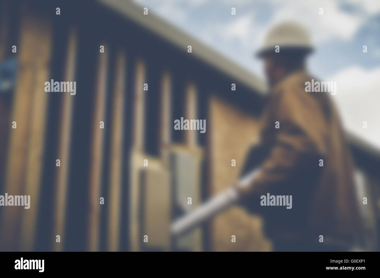 Blurred Construction Inspector Reviewing Construction Site with ...