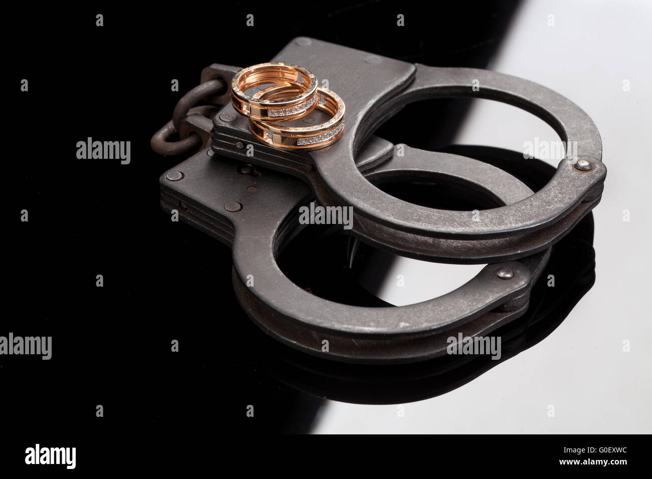 Rings And Handcuffs Stock Photo - Alamy
