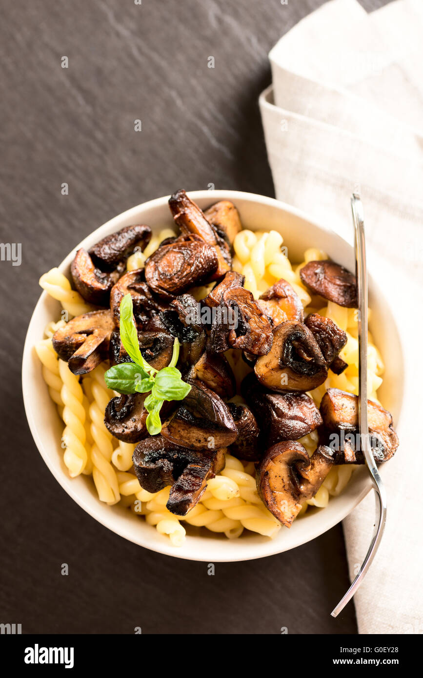 Fusilli with mushrooms Stock Photo - Alamy