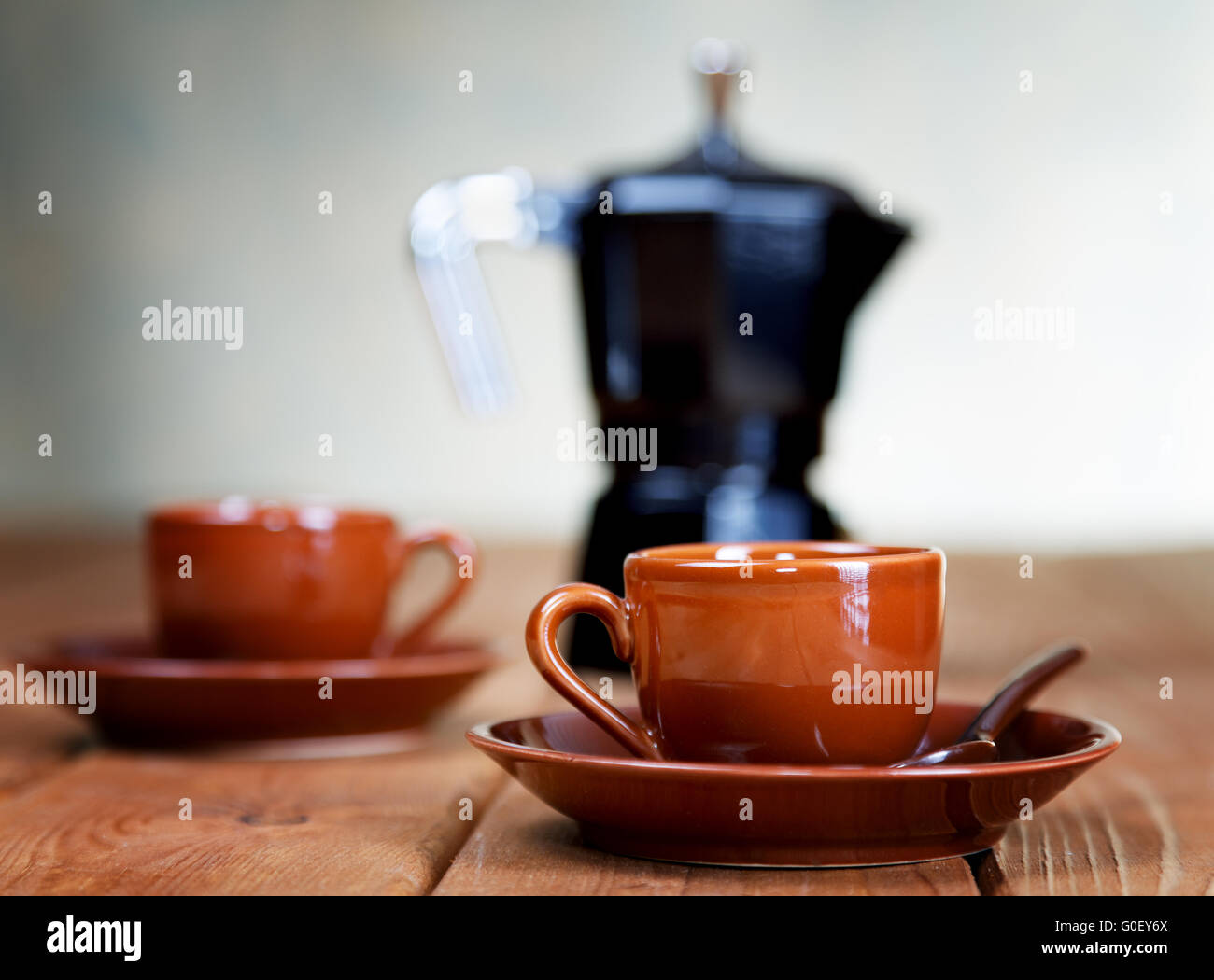 Cups of coffee and a coffee pot on a rural table Stock Photo - Alamy