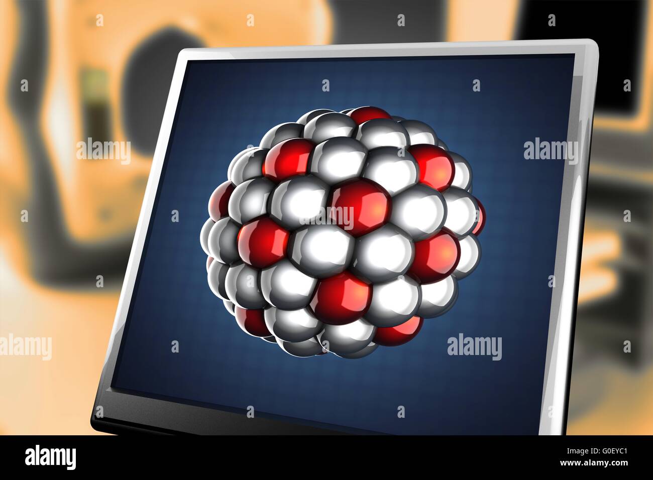 Atom model on blue background at monitor Stock Photo - Alamy