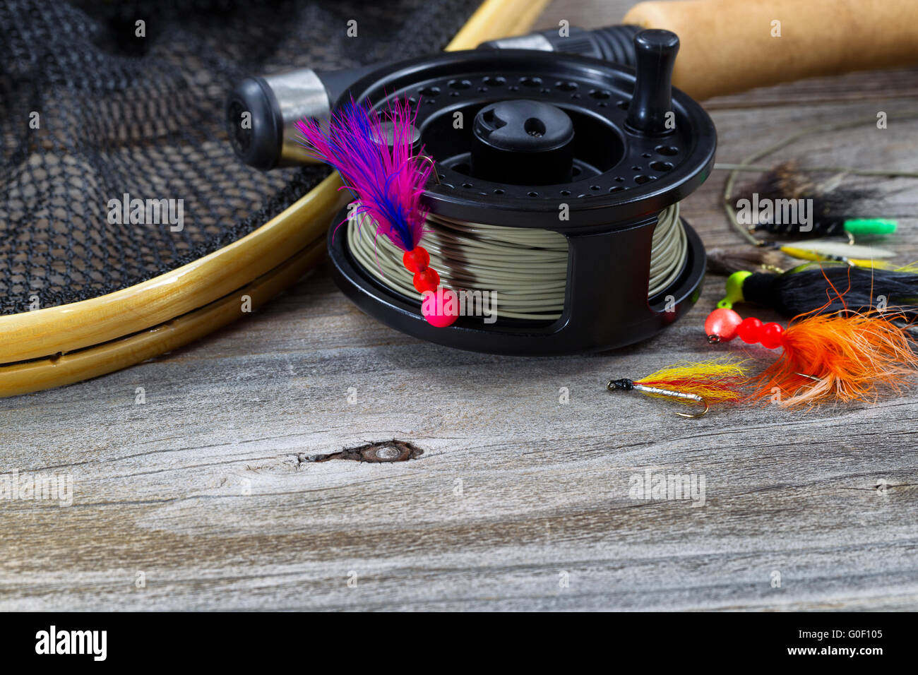 Close up of Fly Reel with fly jig hanging from spool Stock Photo - Alamy