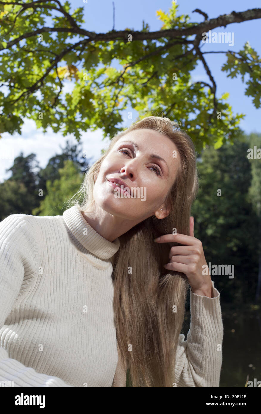 beautiful woman combs long hair in the summer day Stock Photo - Alamy