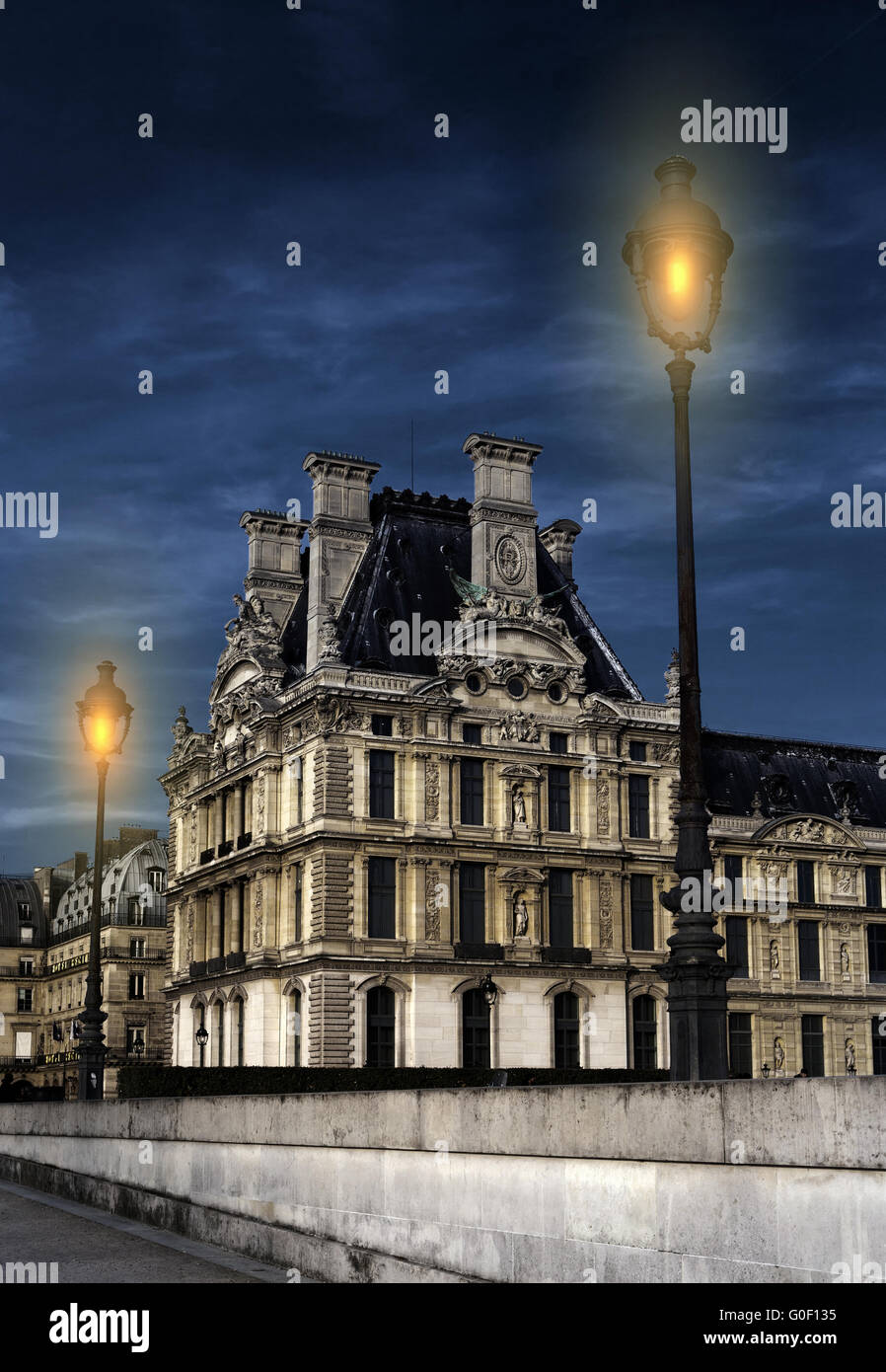 Paris. The cloudy night sky over Louvre Stock Photo - Alamy