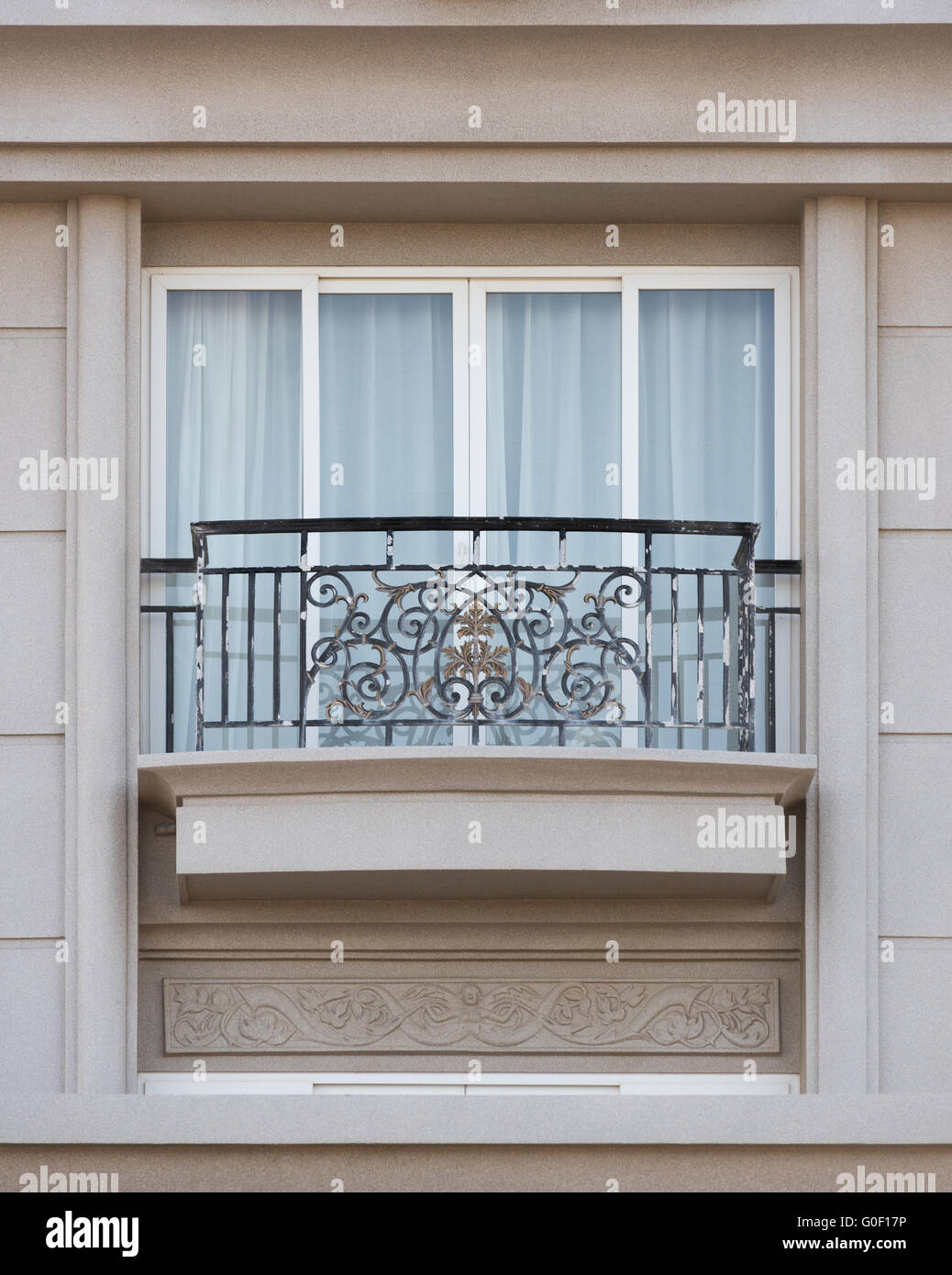 forged balcony in stone building Stock Photo - Alamy