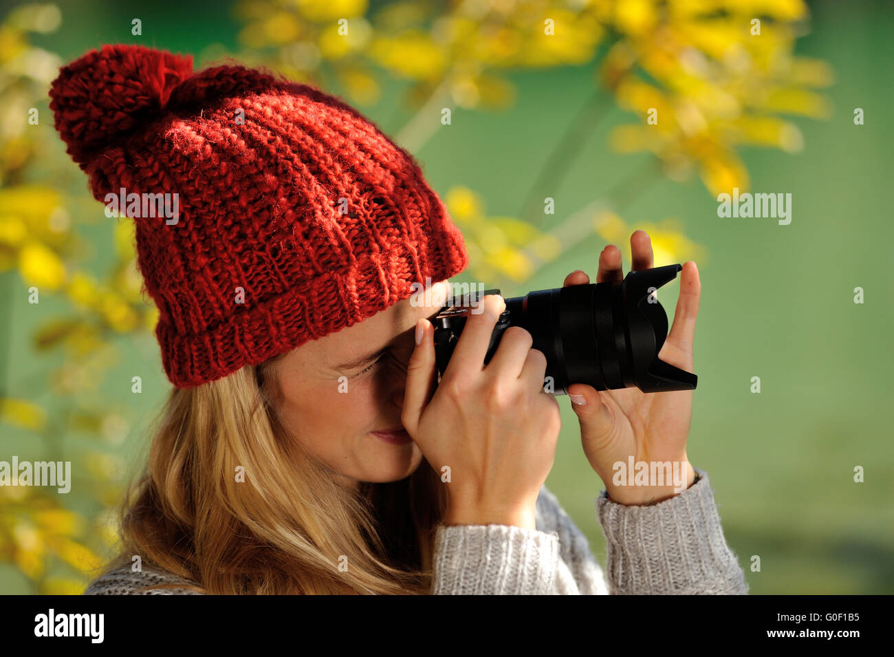Young woman taking pictures Stock Photo - Alamy