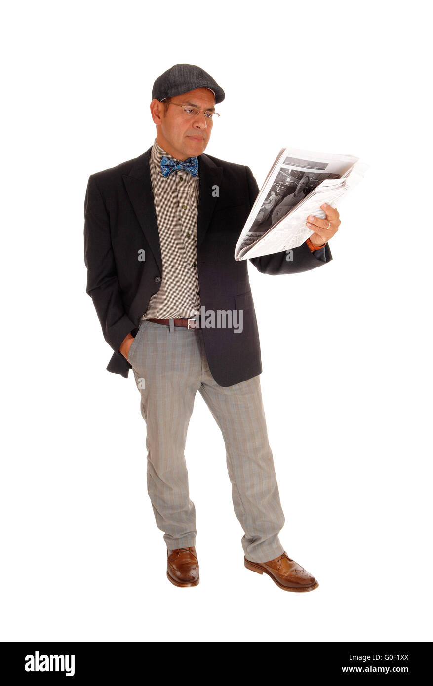 Man standing and reading the newspaper Stock Photo - Alamy