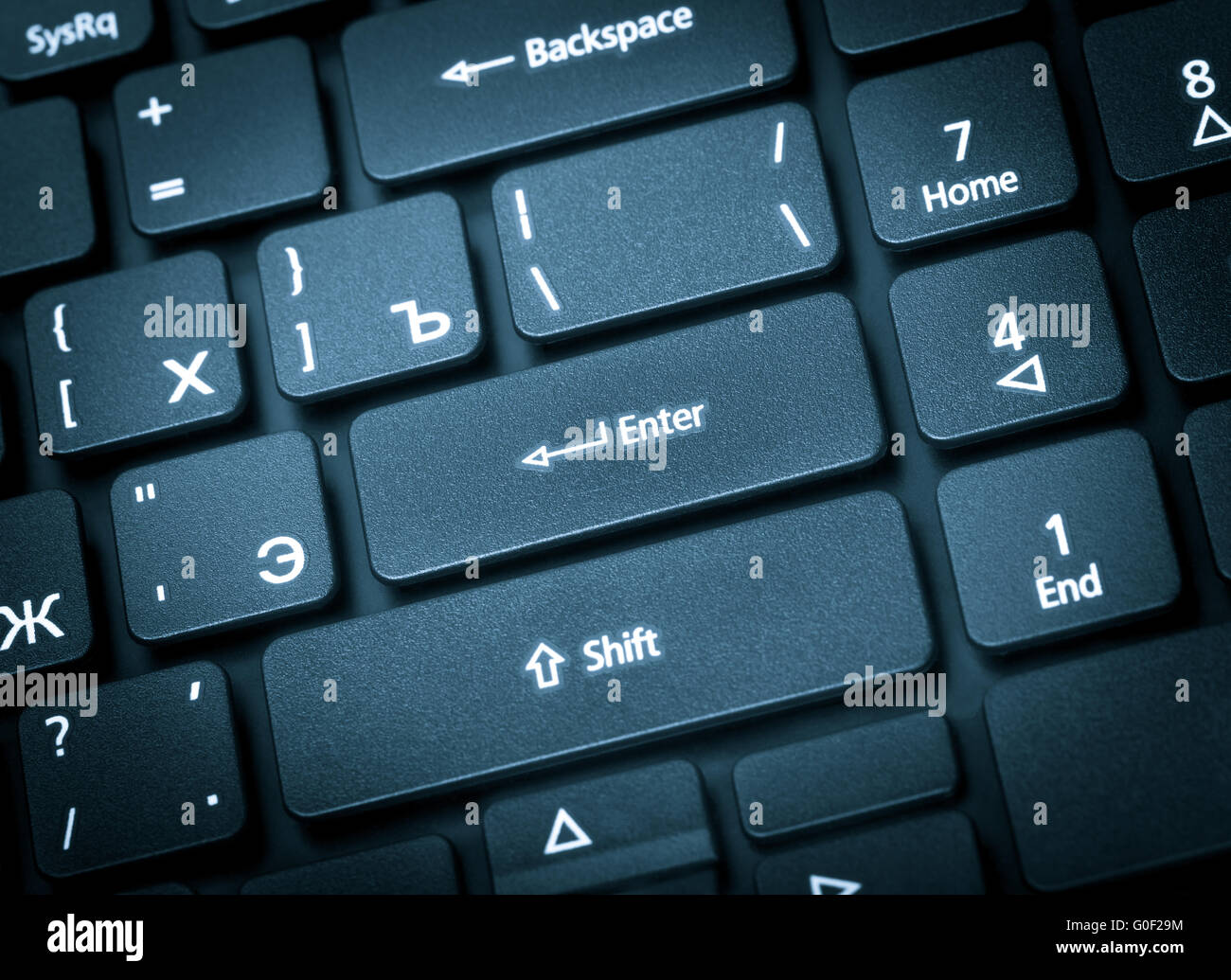 laptop keyboard with russian letter focus on enter Stock Photo - Alamy
