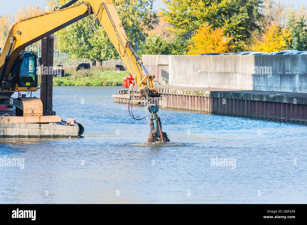Industrial ship with a excavator Stock Photo - Alamy