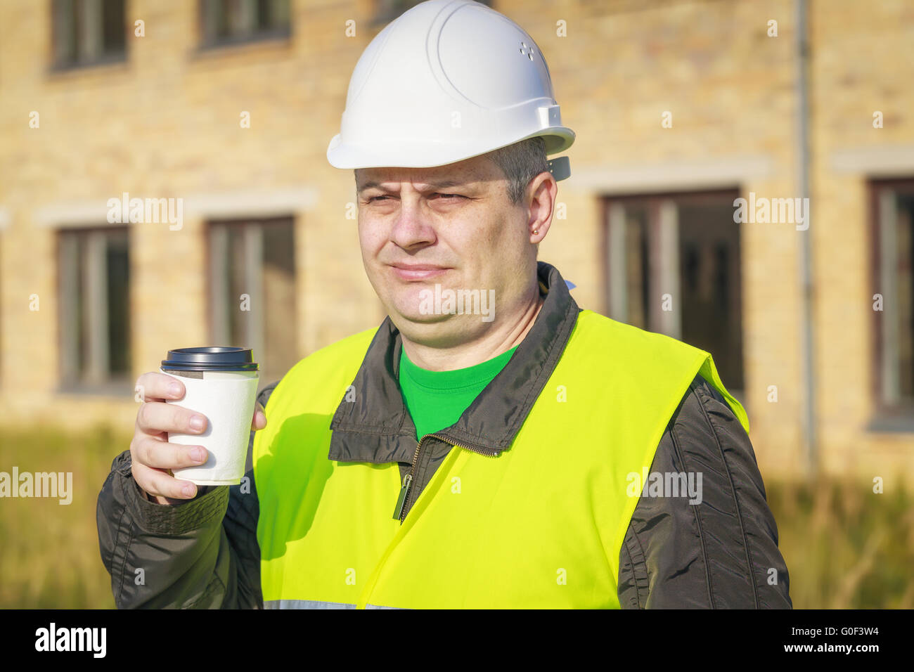 Construction Engineer with cup of coffee Stock Photo - Alamy