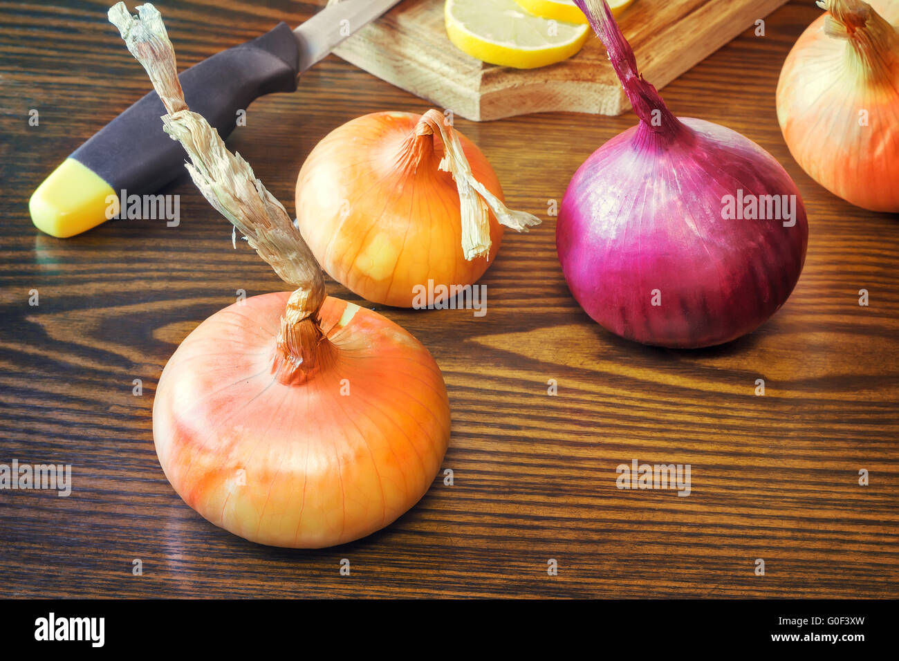 The still life: large onion and lemon on the table Stock Photo - Alamy