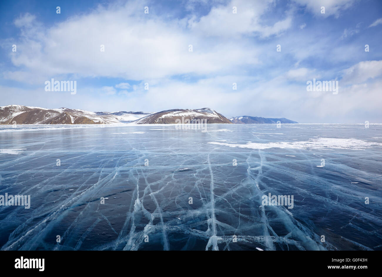 Winter ice landscape on Siberian lake Baikal with clouds Stock Photo ...