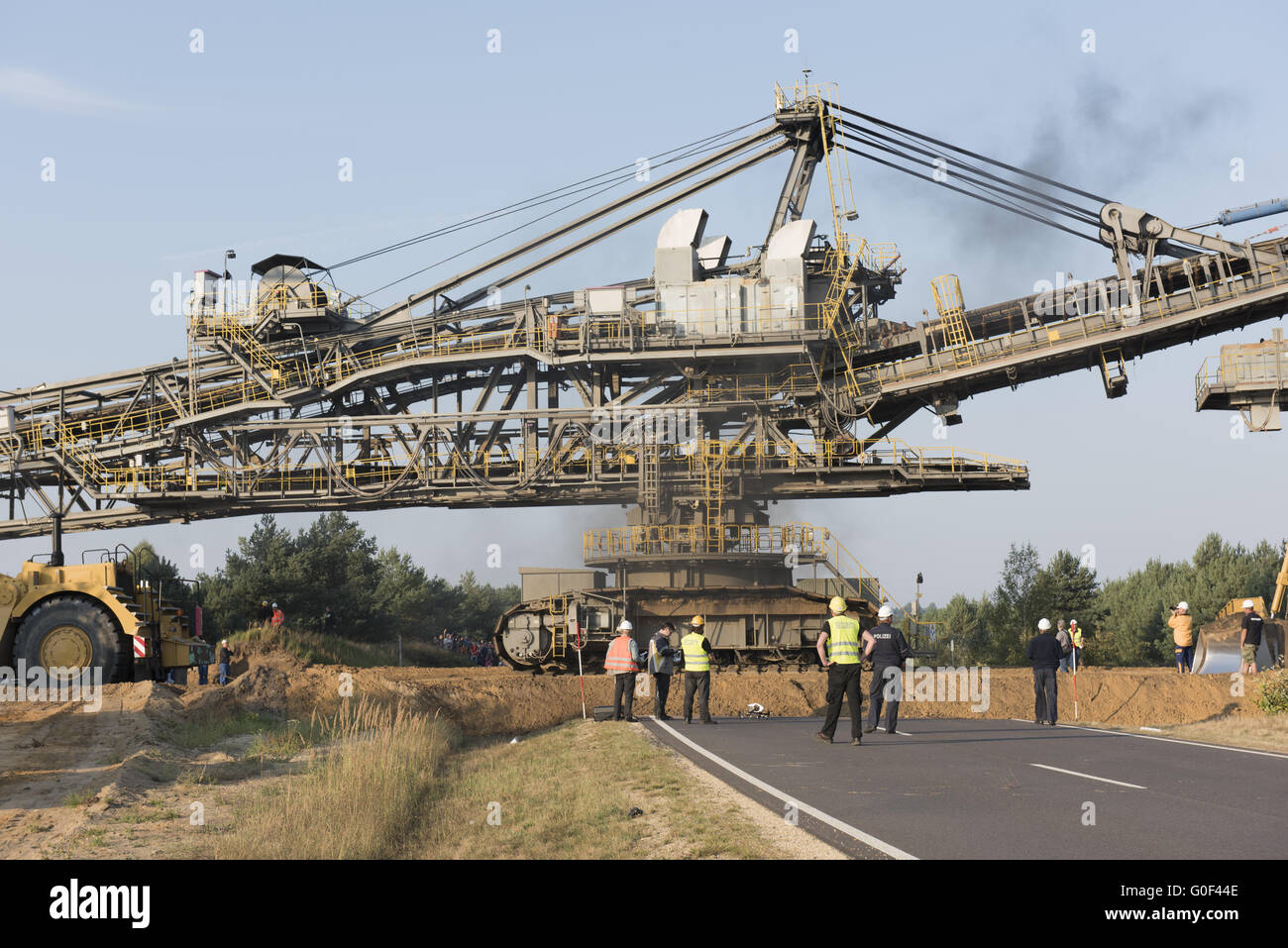 open cast mining tripper car cross a highway Stock Photo - Alamy
