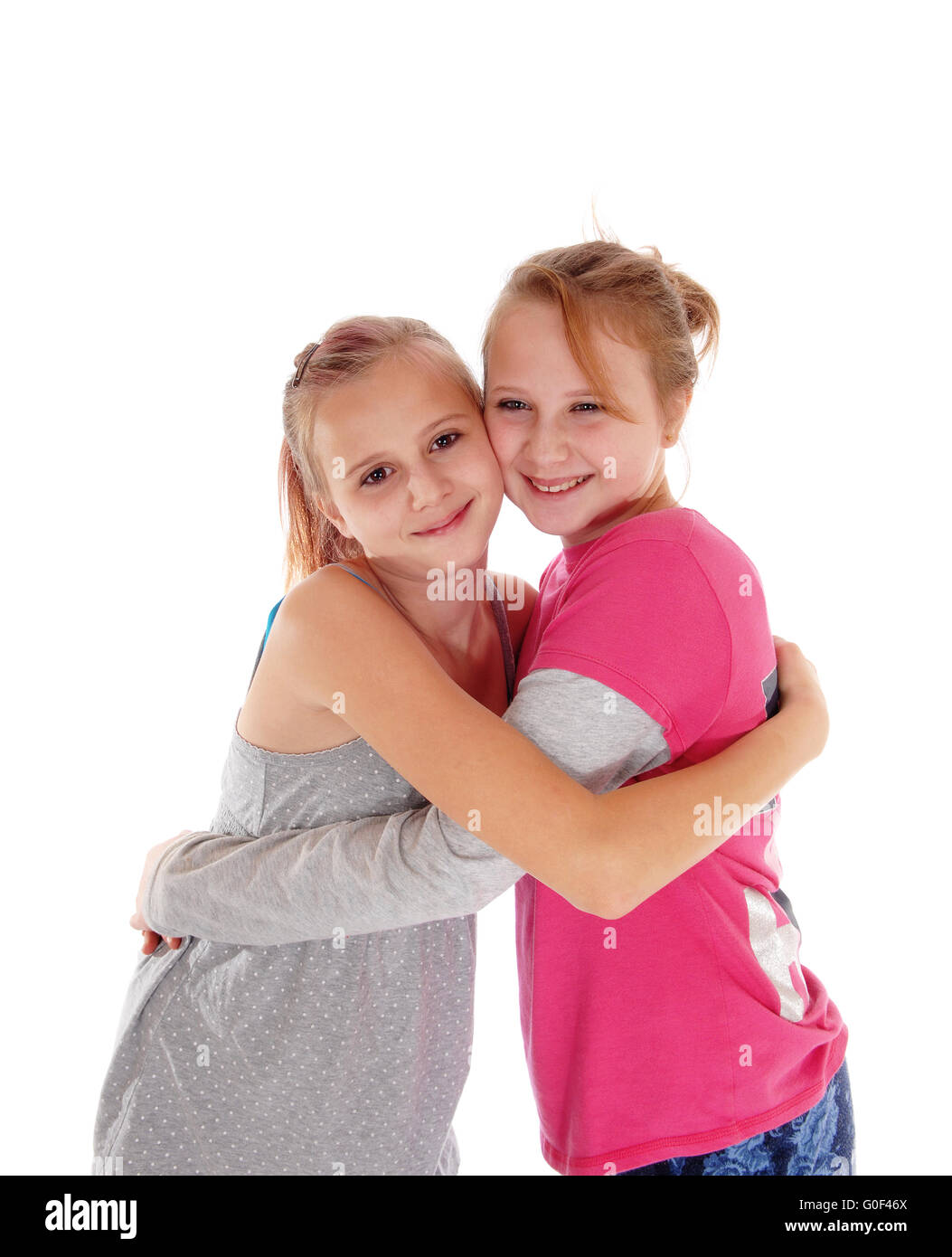 Two sisters embracing each other hi-res stock photography and images ...
