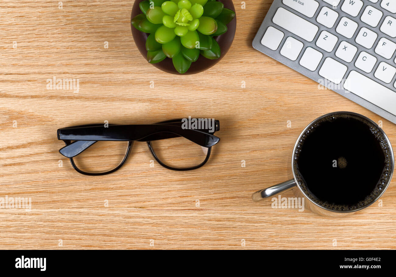 Wooden red oak desktop with bare work essentials Stock Photo - Alamy