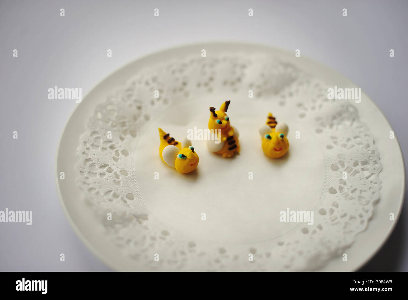 sweet candies of three bee food isolated on white Stock Photo - Alamy