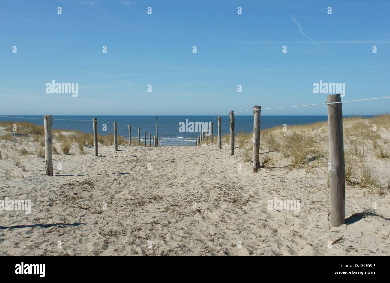 Overlooking the North Sea covered with blue sky and sandy passage Stock ...
